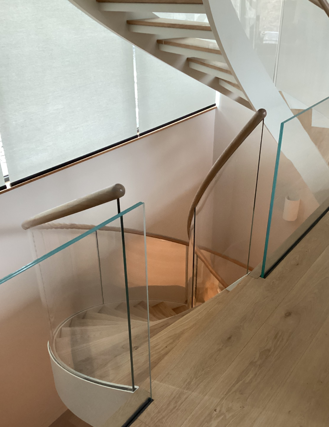 Double flight Helical Staircase with Glass Balustrade